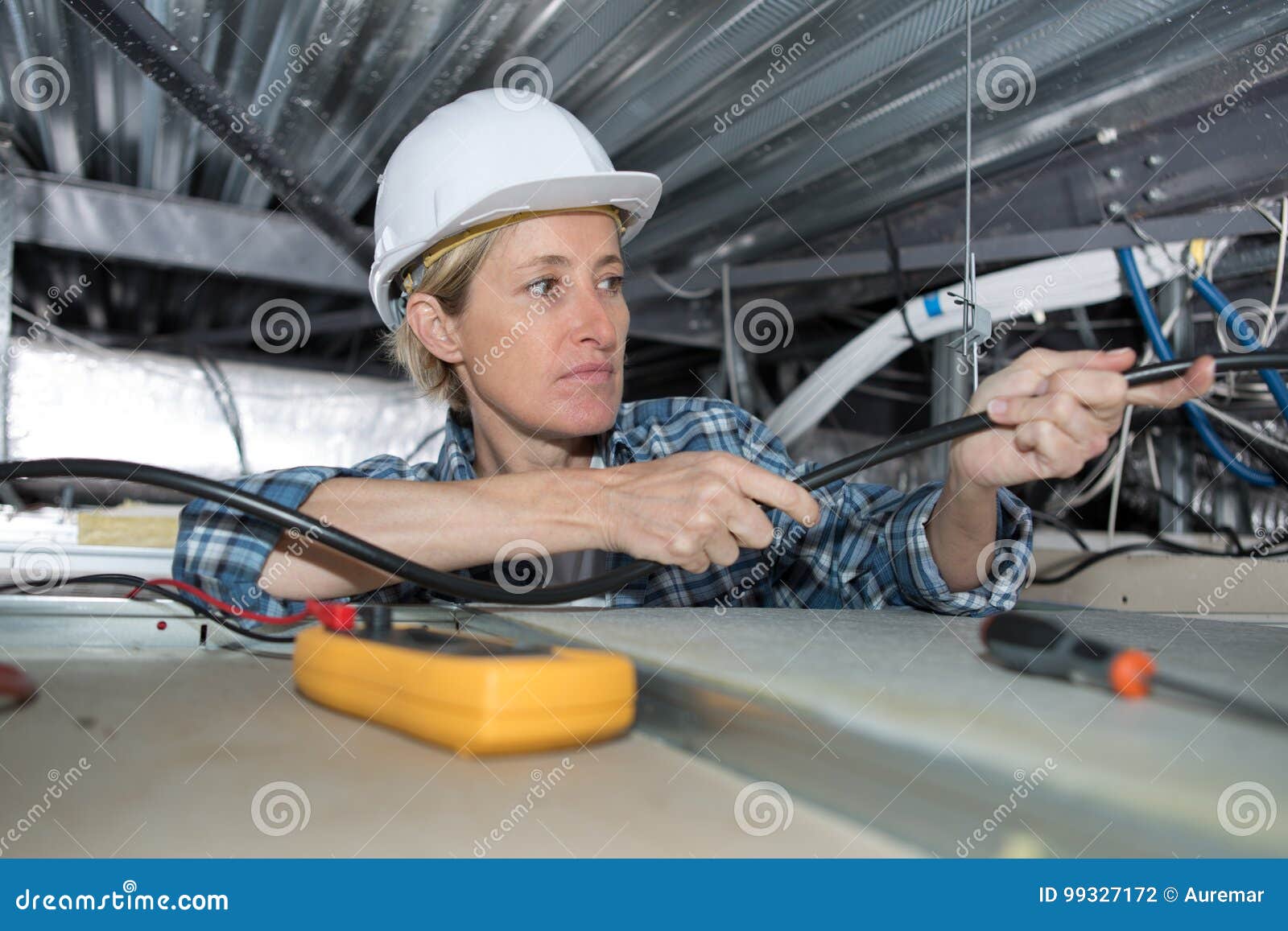 Female Technician Checking Air Conditioning in Ceiling Stock Photo ...