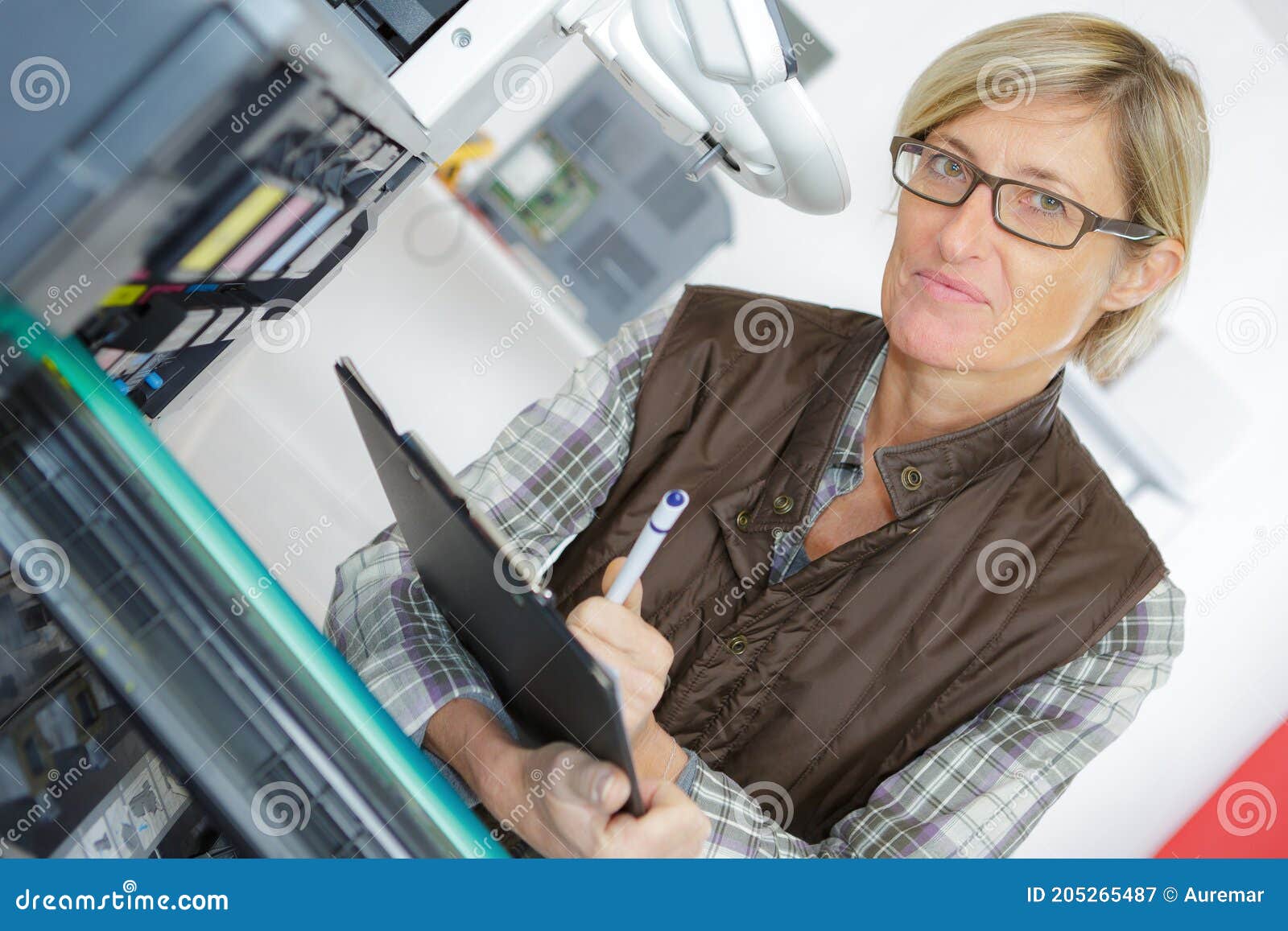 Female Technician Checking Printer Stock Image - Image of development ...