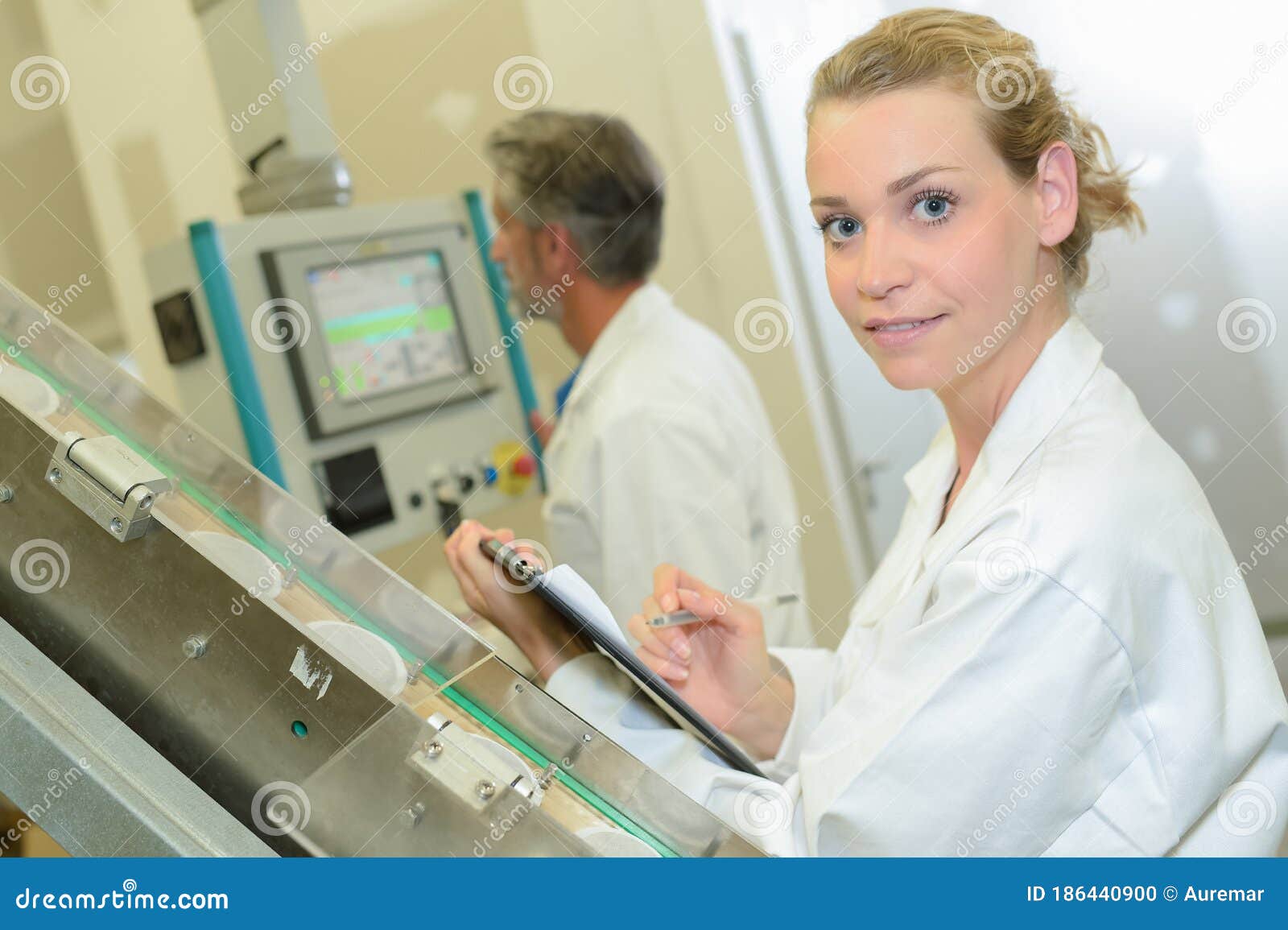 Female Technician Holding Clipboard Stock Photo - Image of cups ...