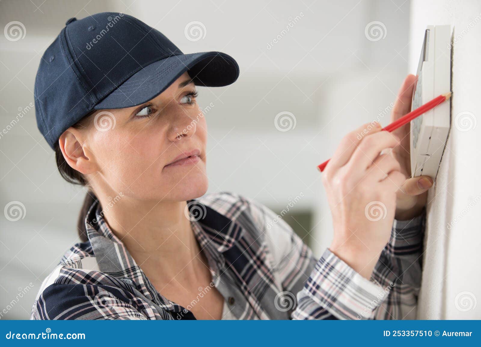 Female Technician Installing Security System Stock Photo - Image of ...