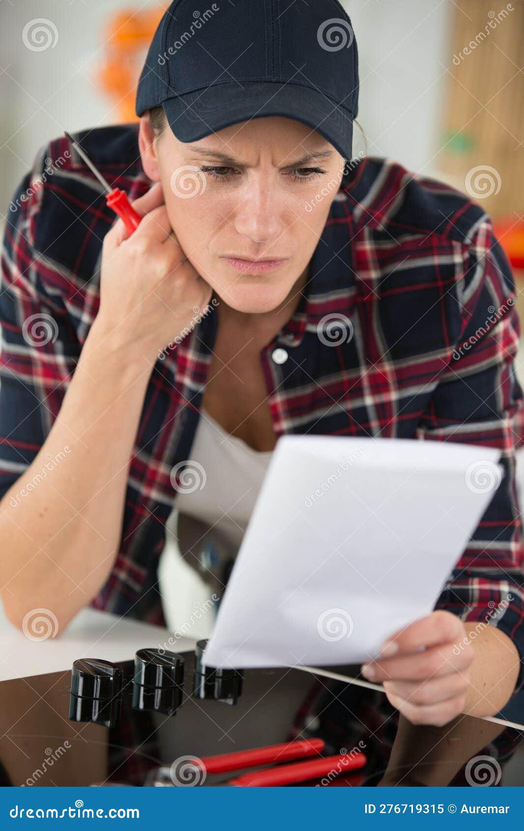 Female Technician Reading Manual Stock Image - Image of fixing ...