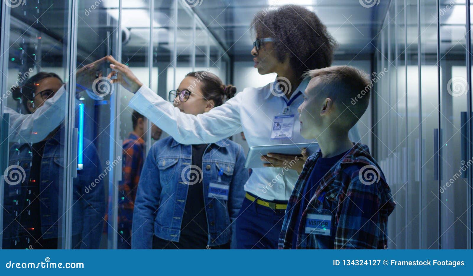 Female Technician Showing Around Children in a Server Park Stock Image ...