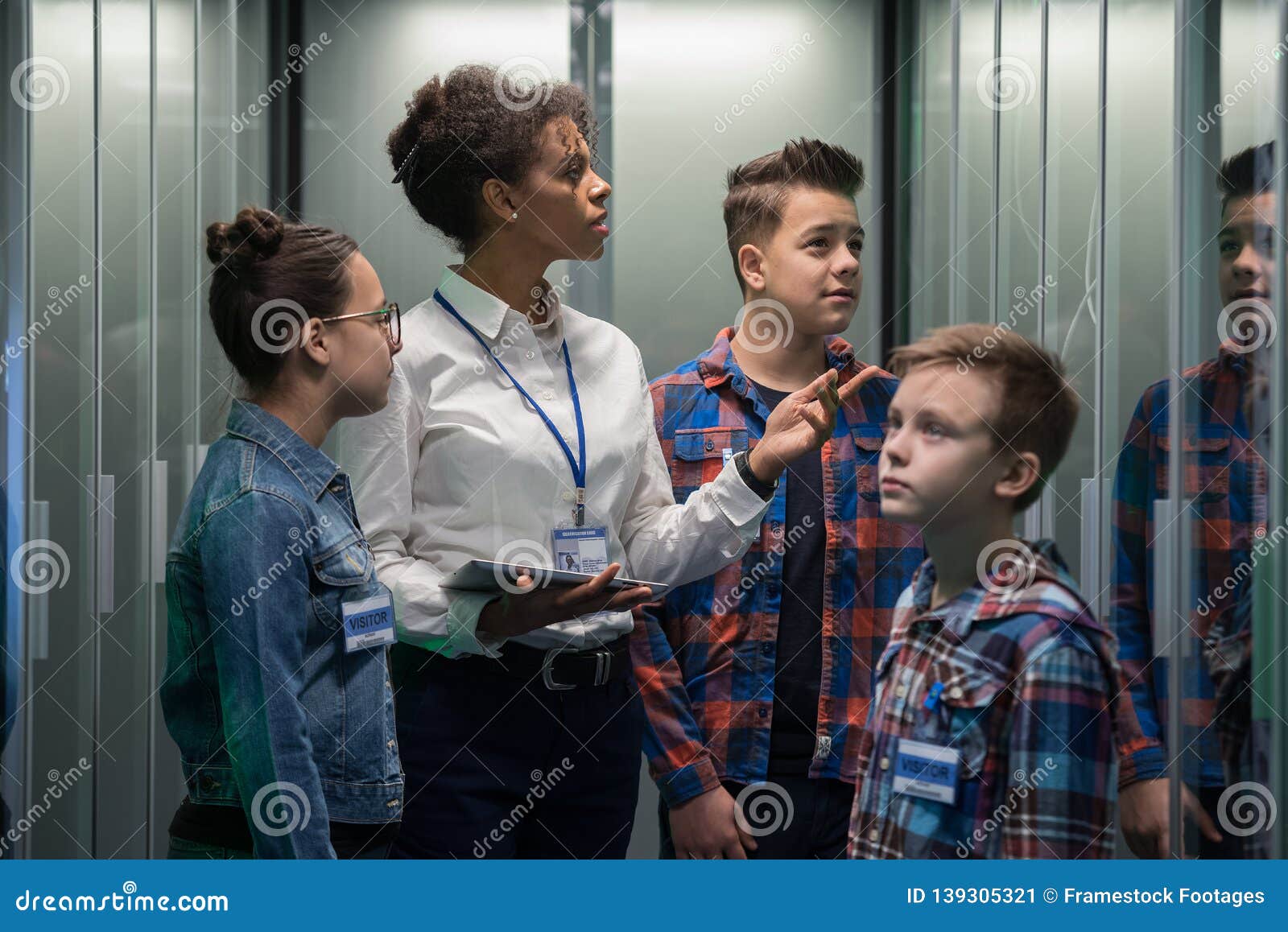 Female Technician Showing Around Children in Server Park Stock Image ...
