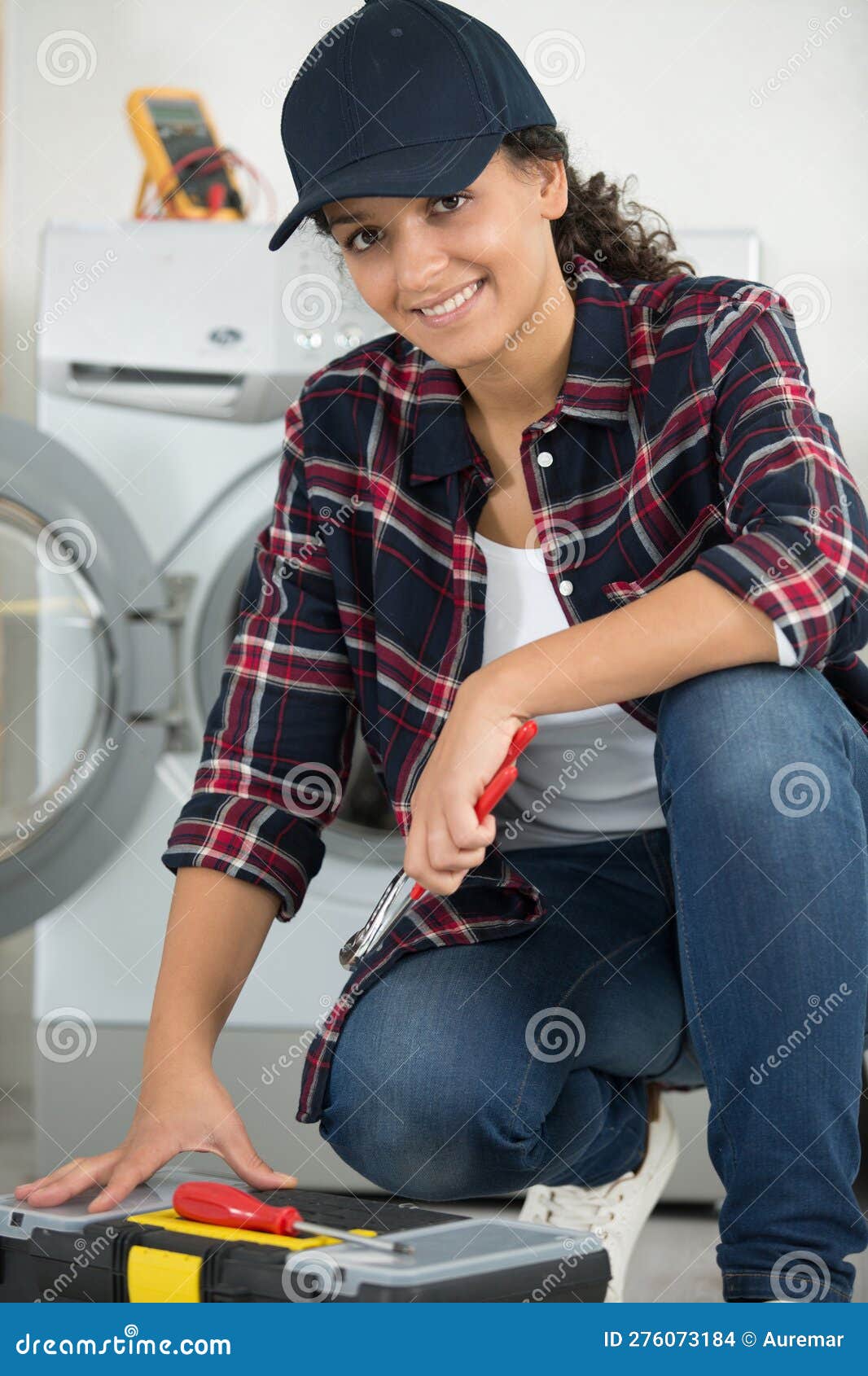 Female Technician with Tool Kit by Washing Machine Stock Photo - Image ...