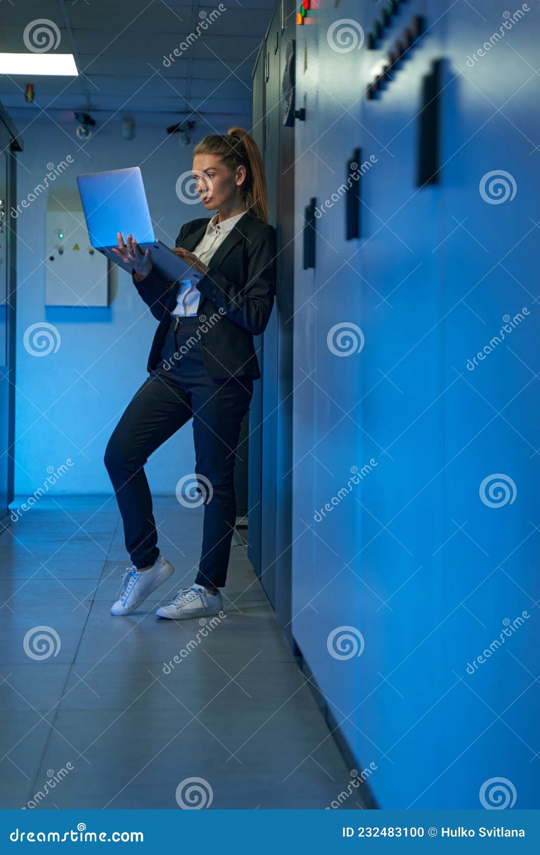 Female Technician Using Laptop in Server Room Stock Photo - Image of ...