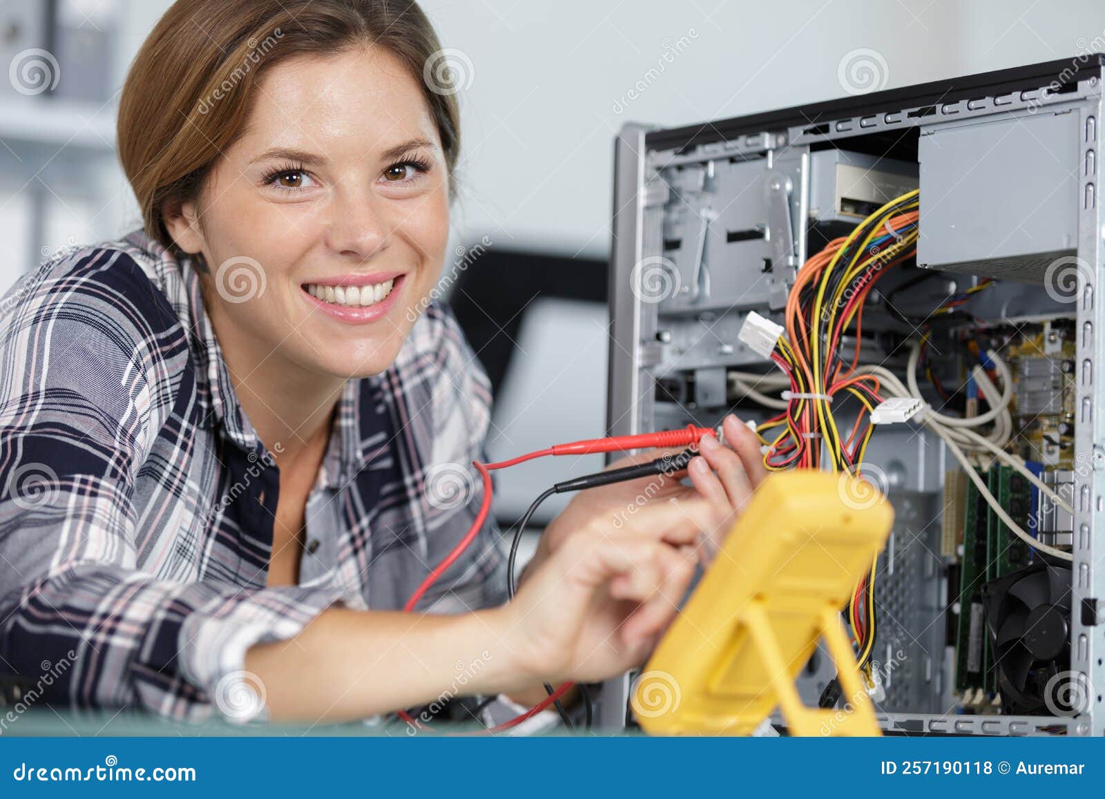 Female Technician Using Multimeter on Tower Computer Stock Photo ...