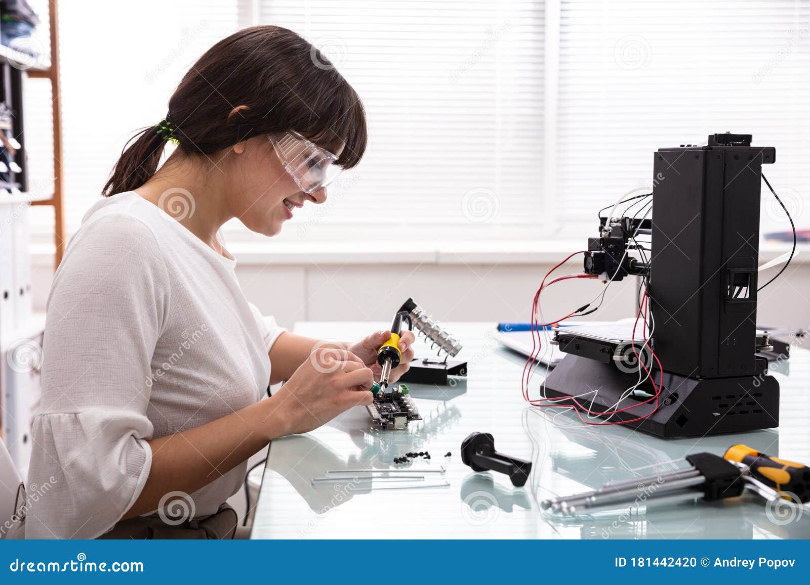 Female Technician Using Soldering Iron Stock Photo - Image of machine ...