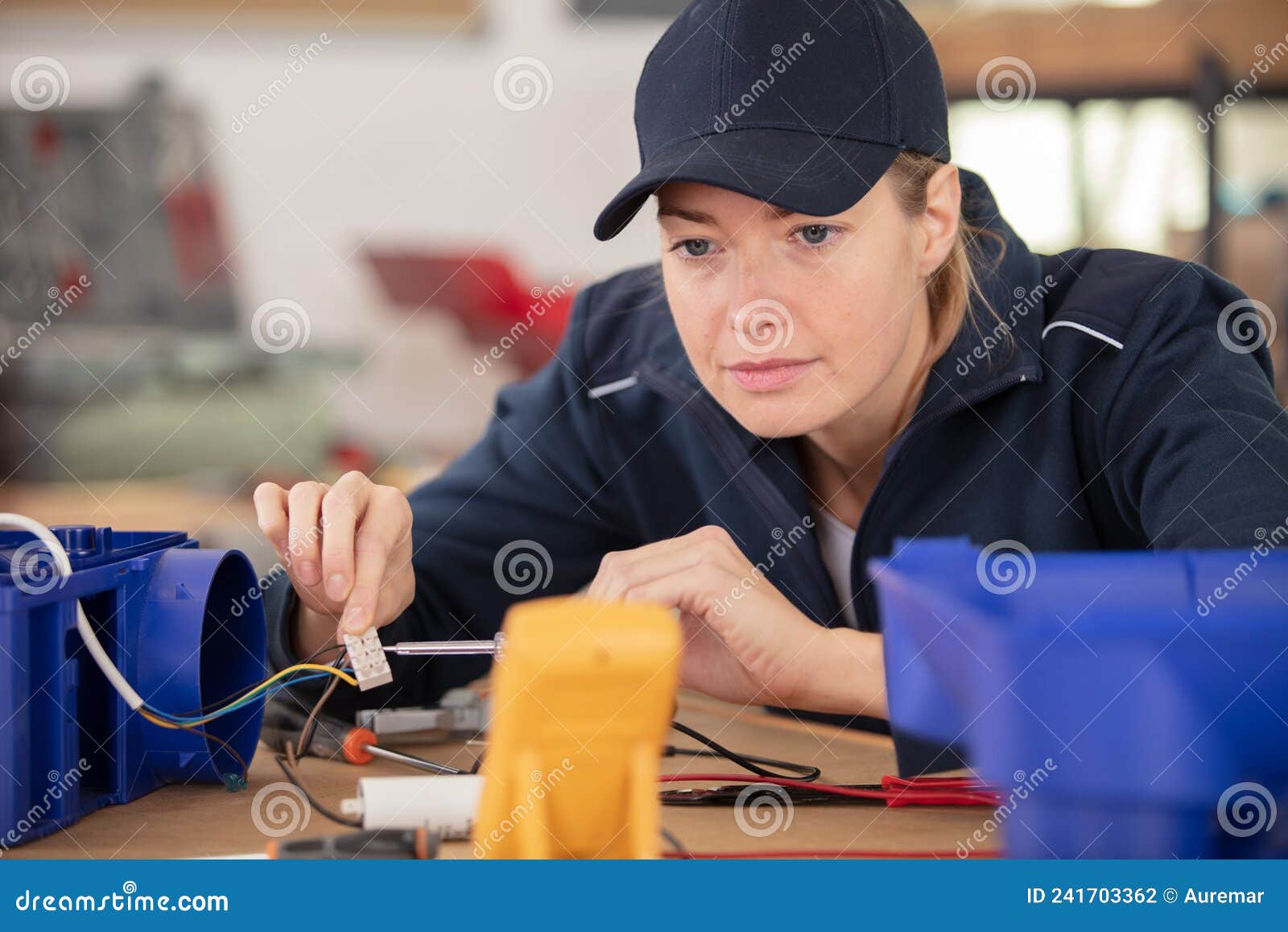 Female Technician Wiring Cables into Chocolate Box Stock Photo - Image ...