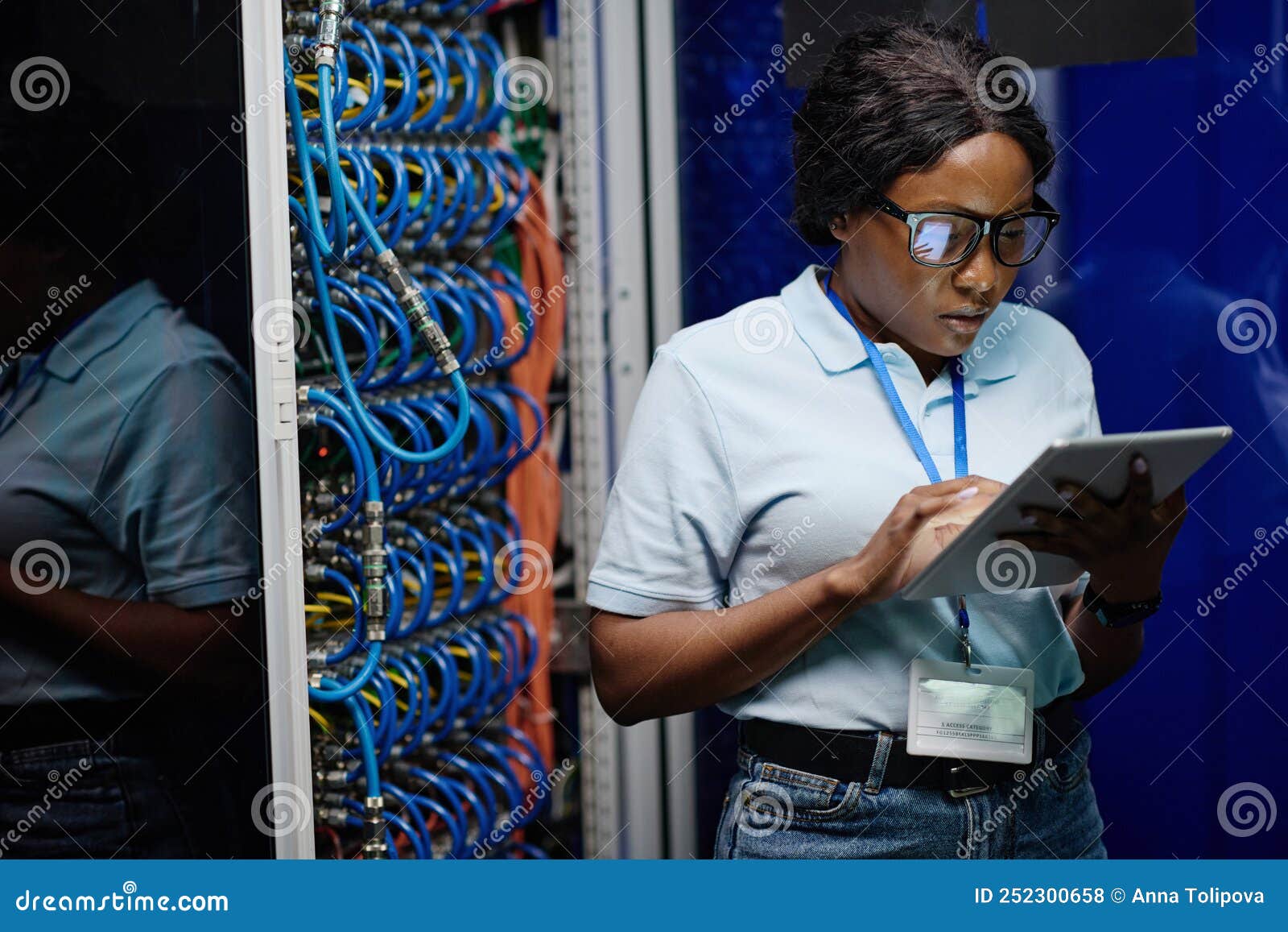Female Technician Working on Tablet in Data Center Stock Photo - Image ...