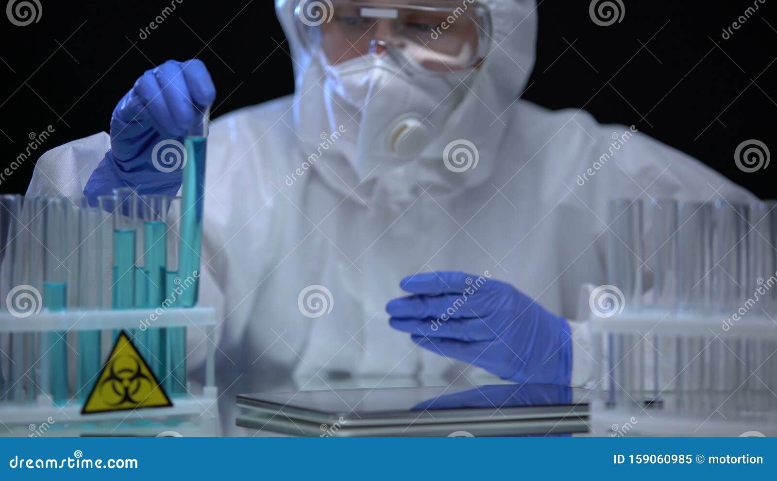 Female Toxic Lab Worker Making Notes on Tablet Analyzing Biohazard ...