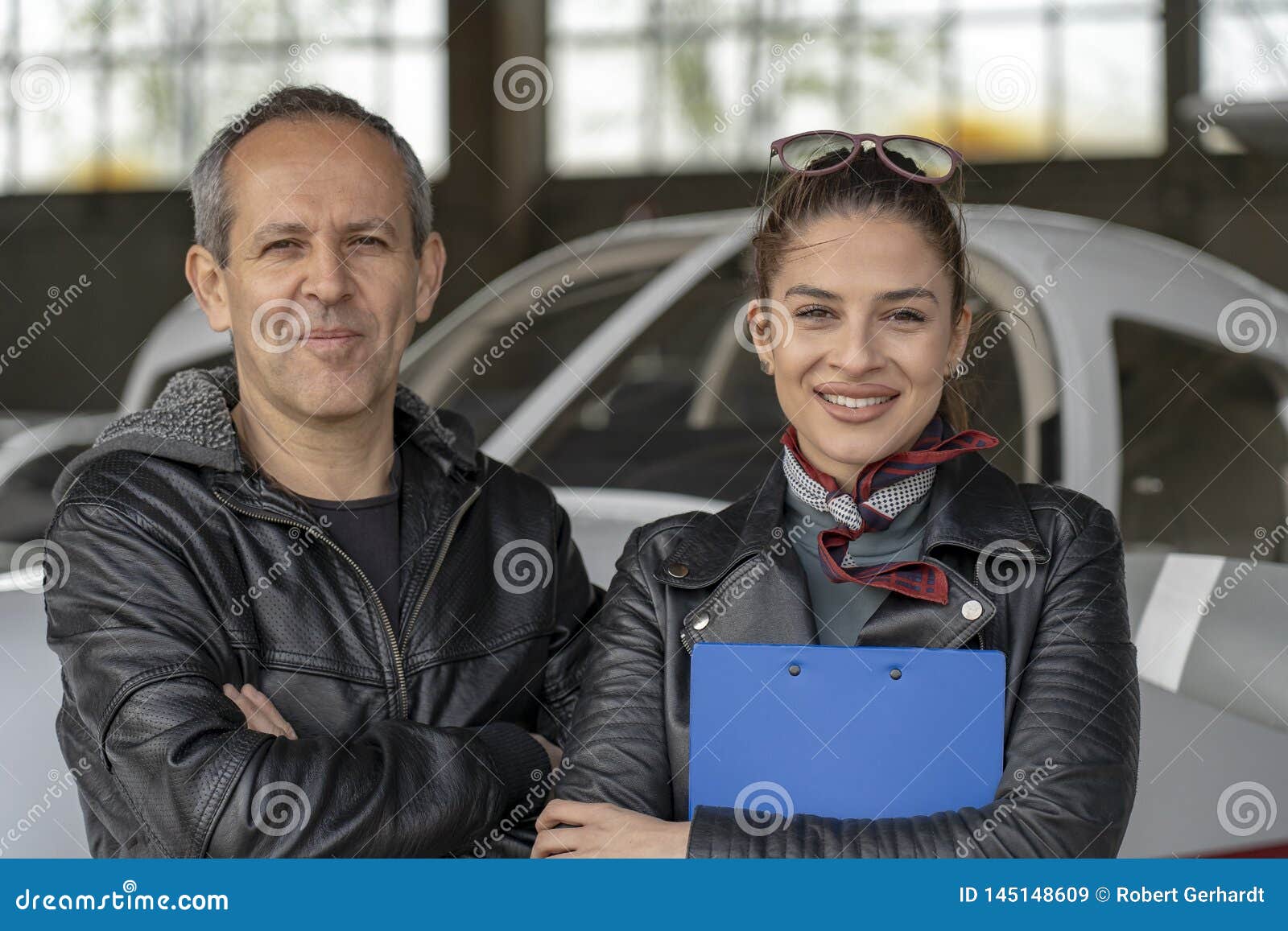 Two Smiling Pilots at the Airport Stock Image - Image of coworkers ...