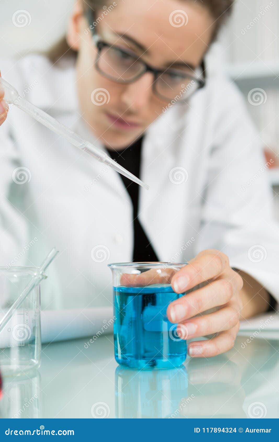 Female Trainee Working with Chemical Liquids in Lab Stock Photo - Image ... Female Trainee Working with Chemical Liquids in Lab Stock Photo - Image ...