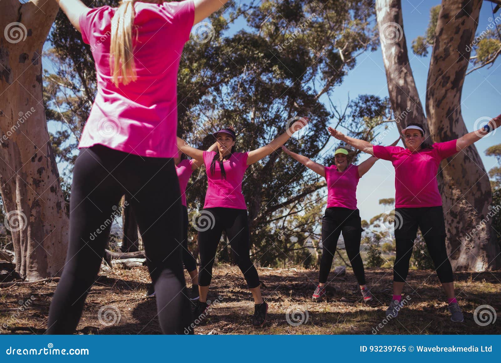 Female Trainer Instructing Women while Exercising in the Boot Camp ...