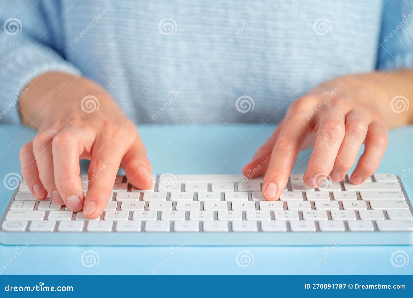 Female Typing Text on White Keyboard on Blue Background. Copy Space ...