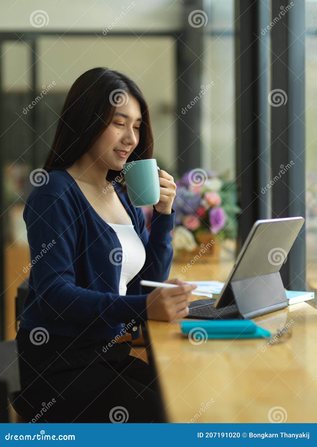 Female University Student Take a Coffee Break while Doing Assignment ...