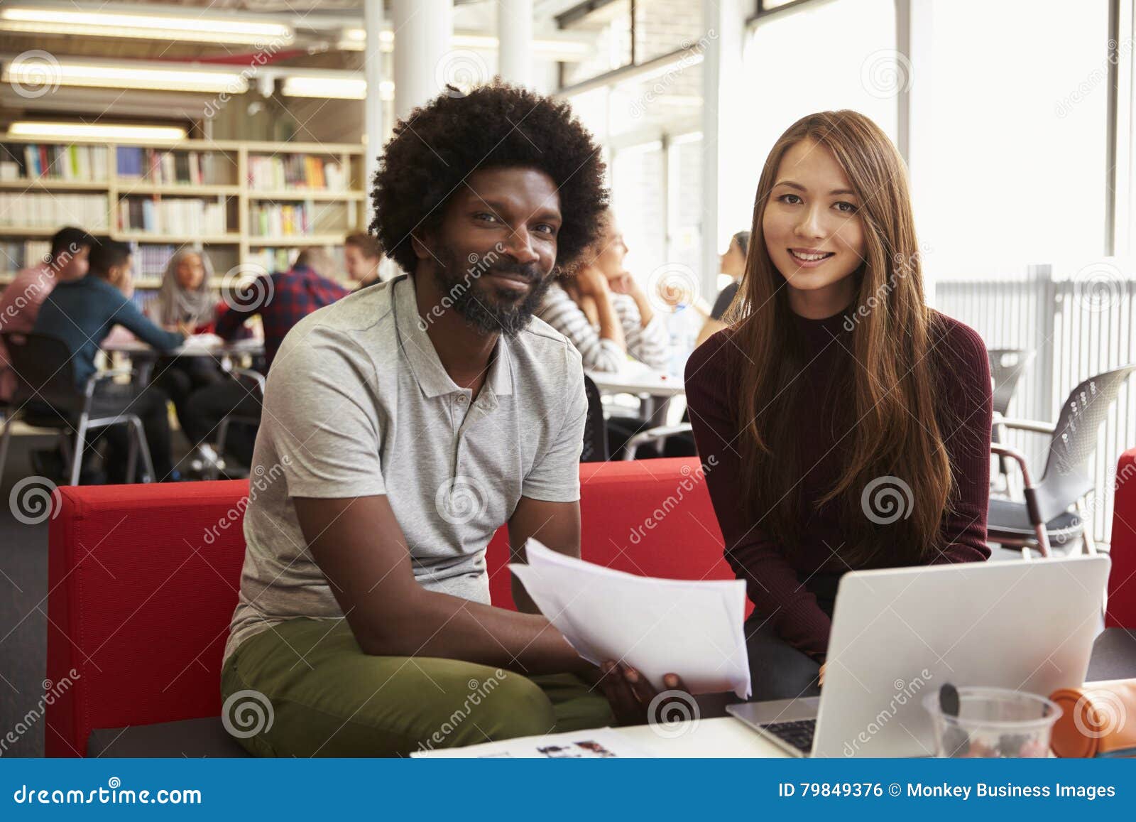 Female University Student Working in Library with Tutor Stock Photo ...