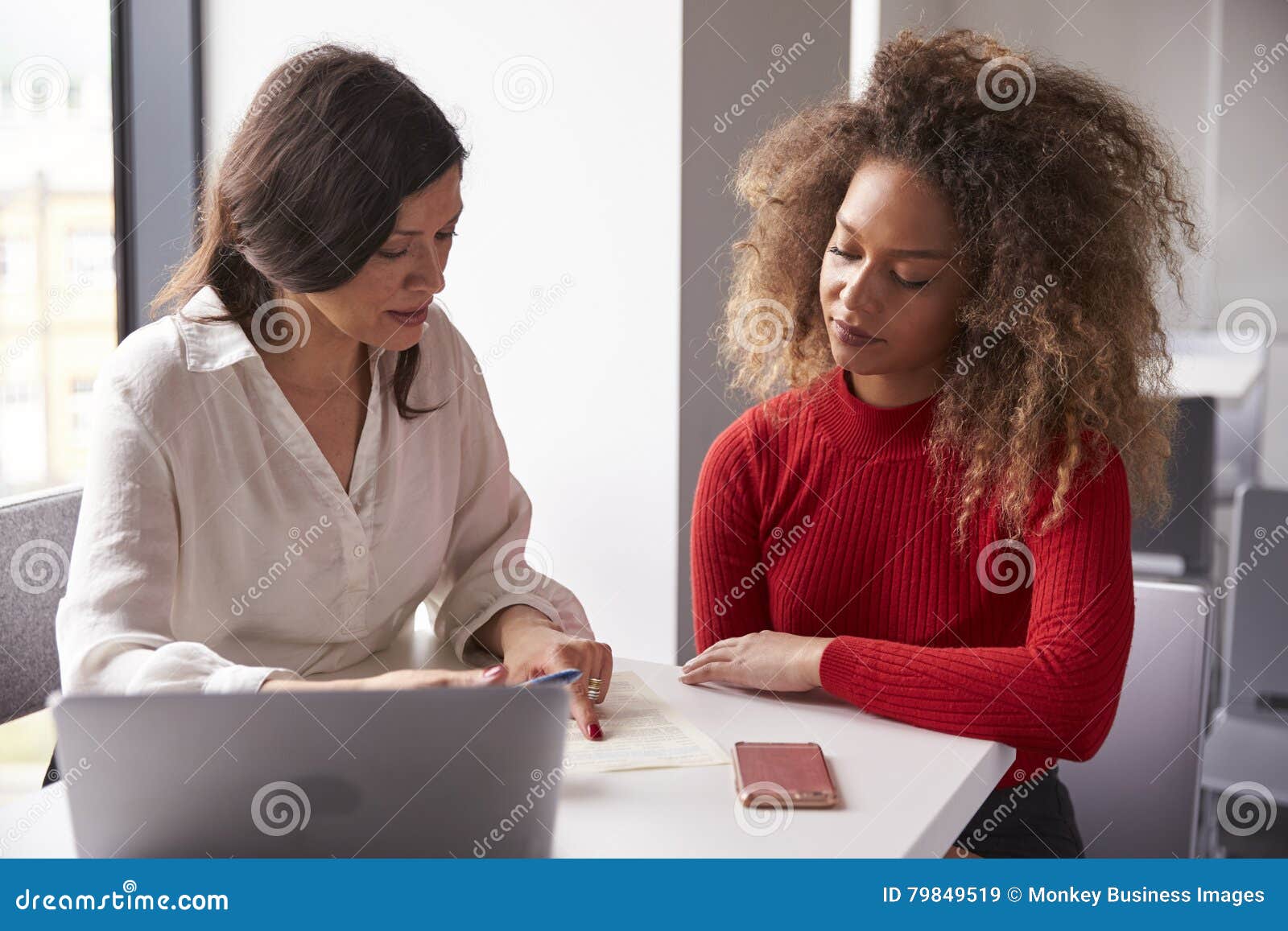 Female University Student Working One To One with Tutor Stock Image ...