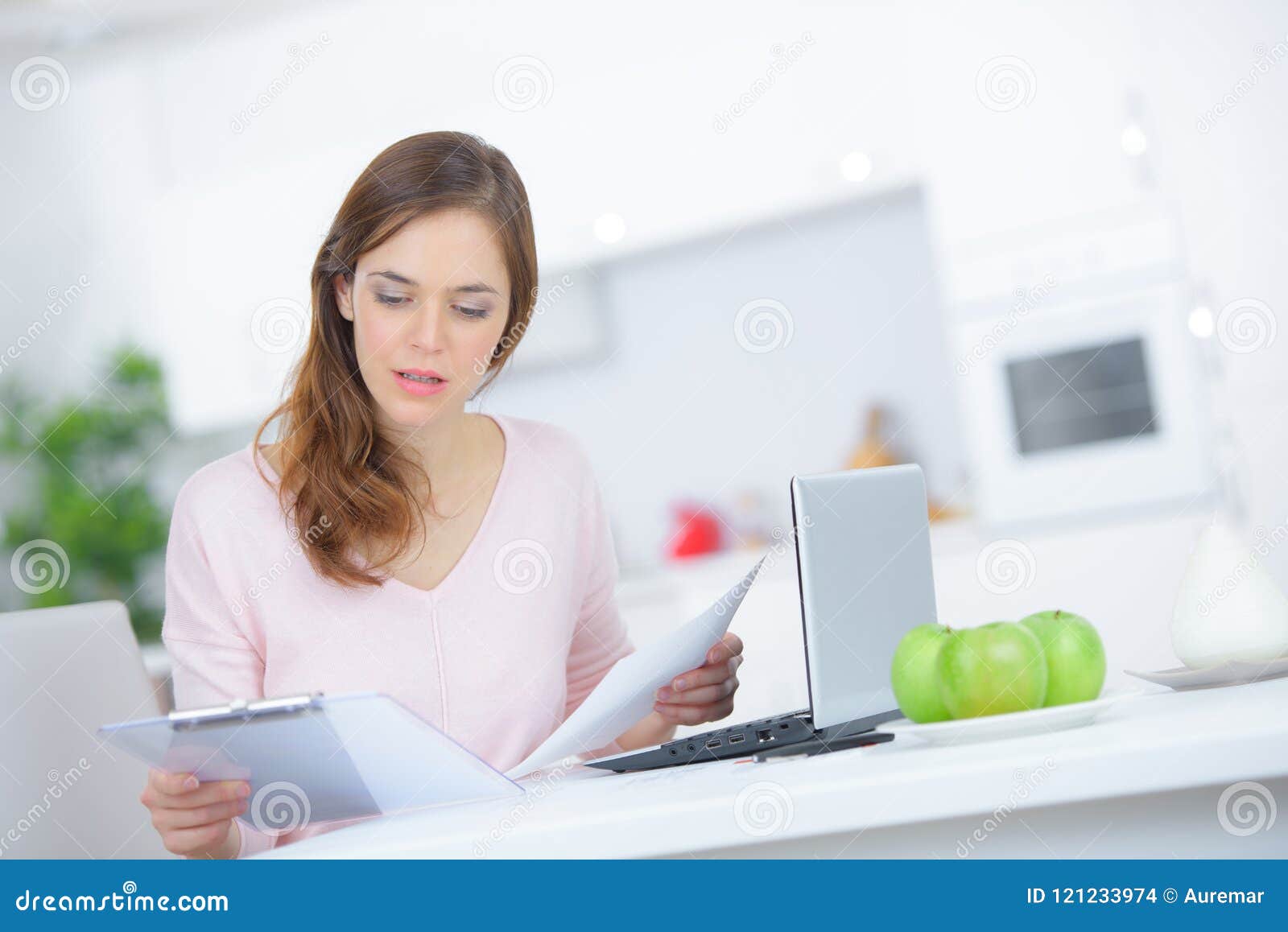 Female Using Computer and Laptop in Kitchen Stock Photo - Image of ...