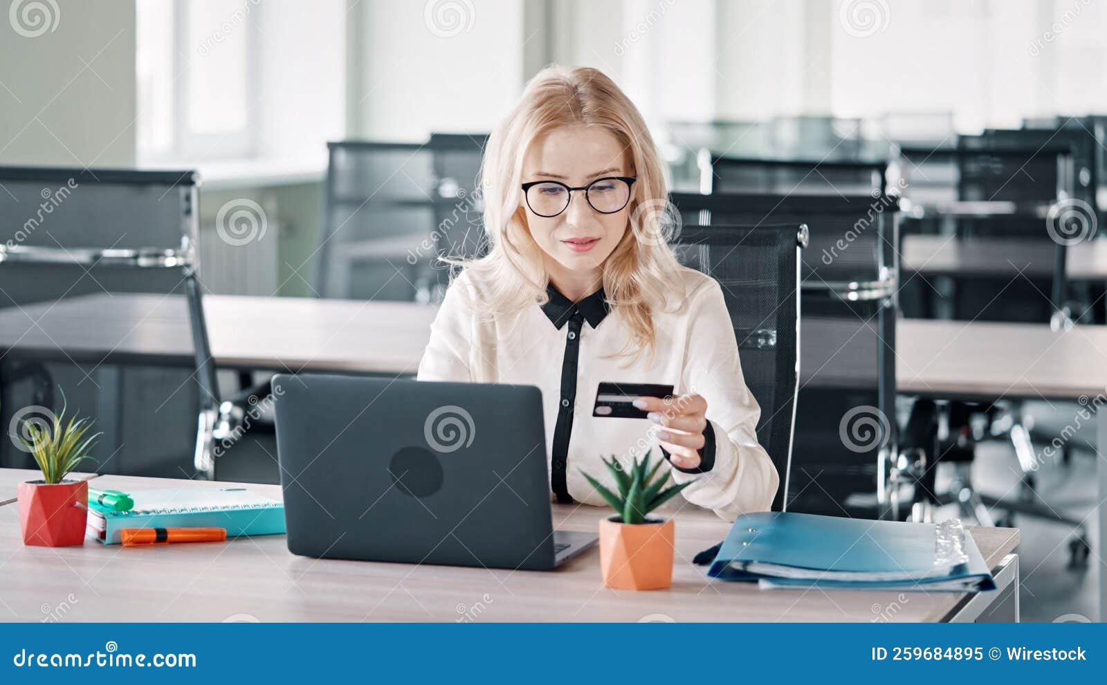 Female Using Her Card for Online Shopping from the Office Stock Image ...
