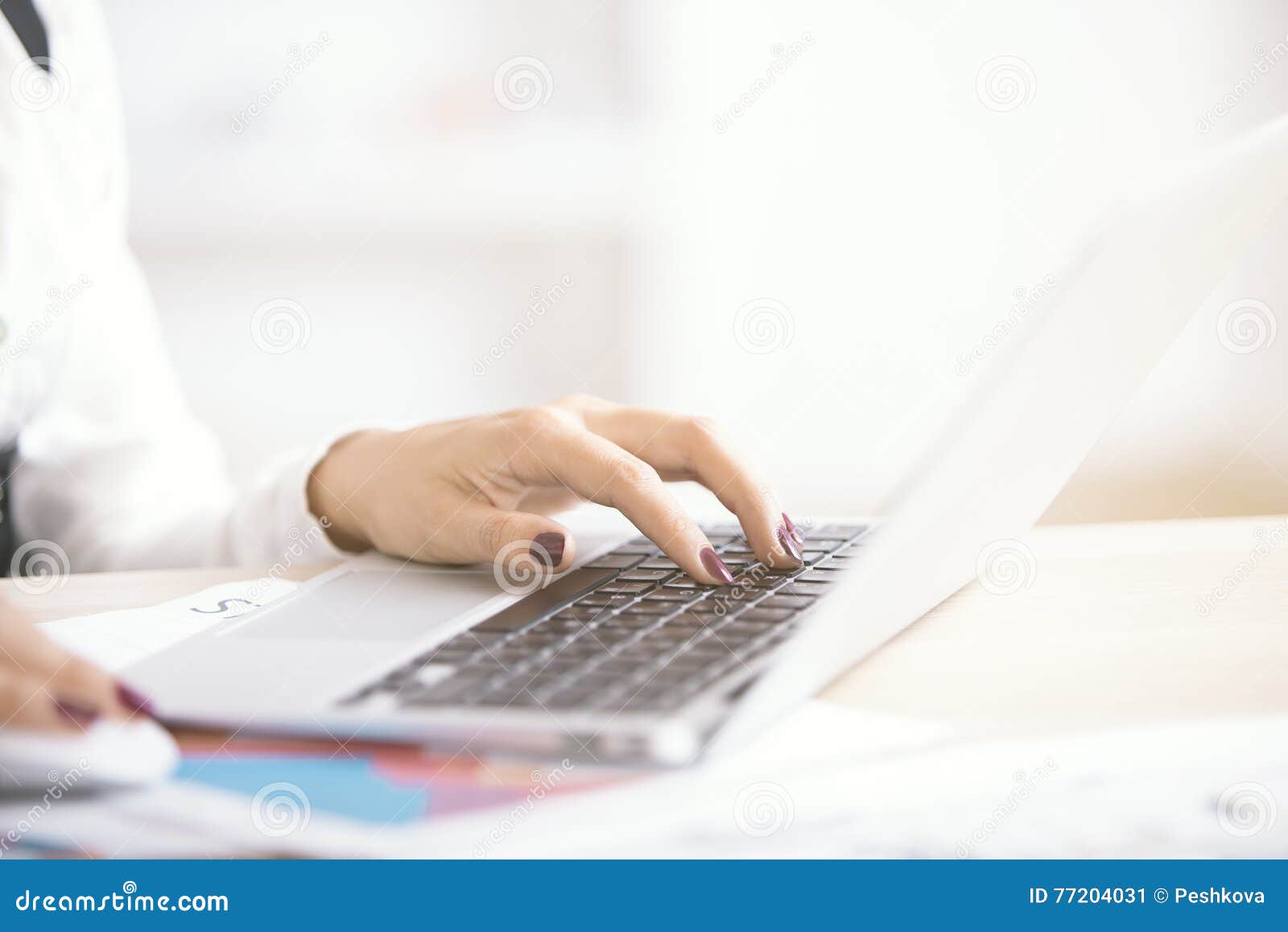 Female using laptop side stock image. Image of paperwork - 77204031