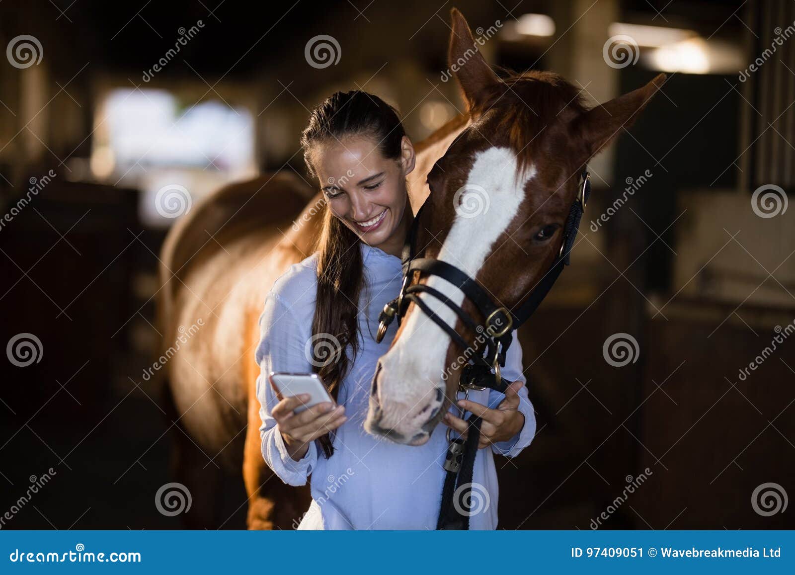 Female Vet Using Mobile Phone while Standing by Horse Stock Image ...