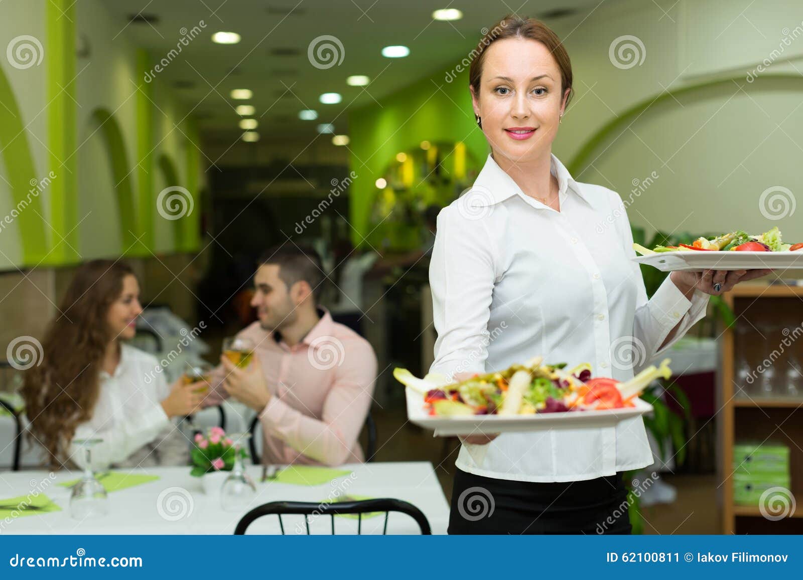 Female Waiter Serving Guests Table Stock Image - Image of person ...
