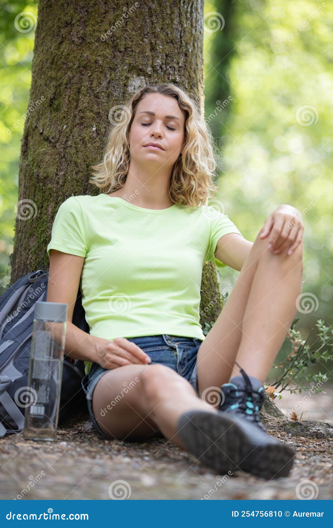 Female Walker Taking Rest Against Tree Stock Photo - Image of backpack ...