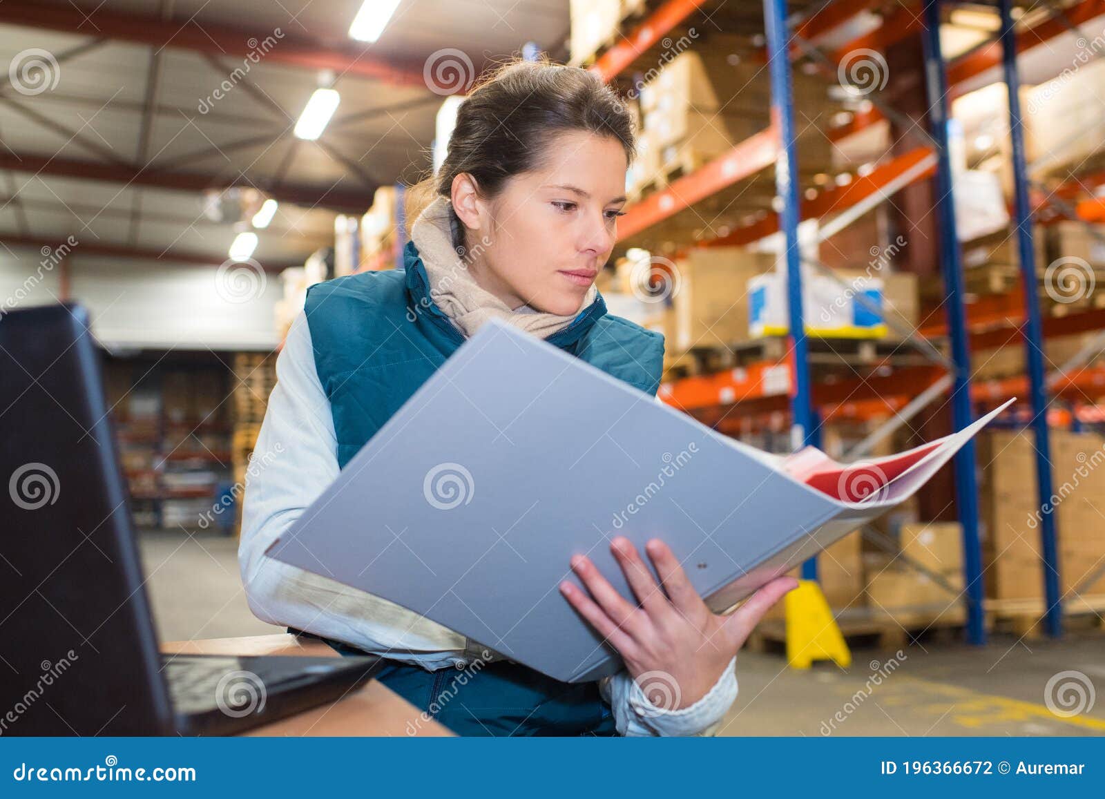 Female Warehouse Manager with File Folder in Warehouse Stock Photo ...