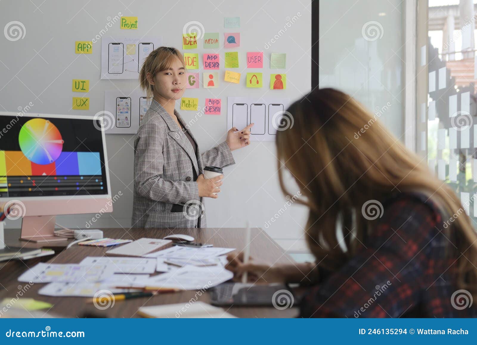 Female Web Designer Presenting Mobile Application Framework at Meeting ...