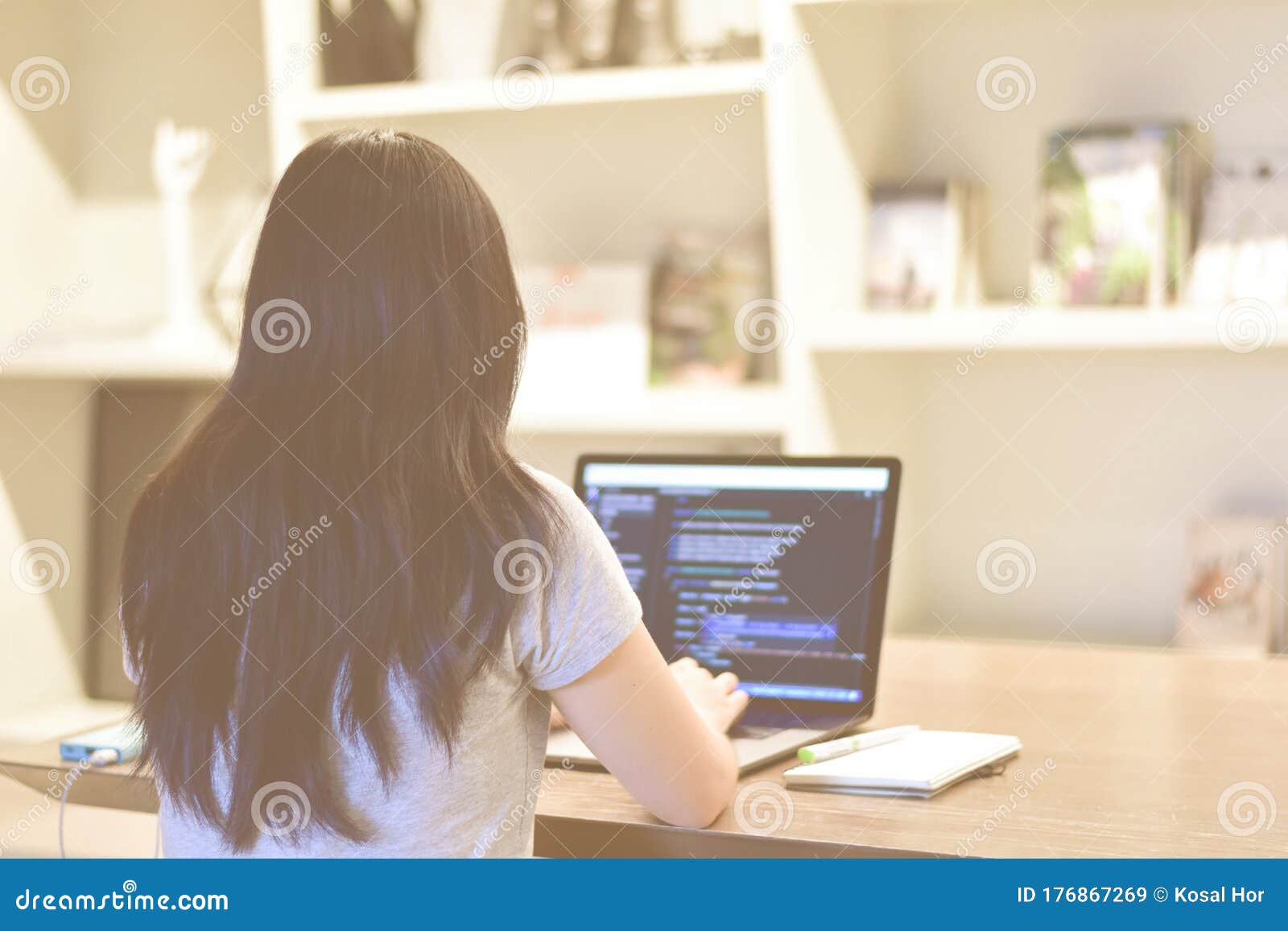 Female Web Developer Writing Code on Laptop in Co-working Space As ...