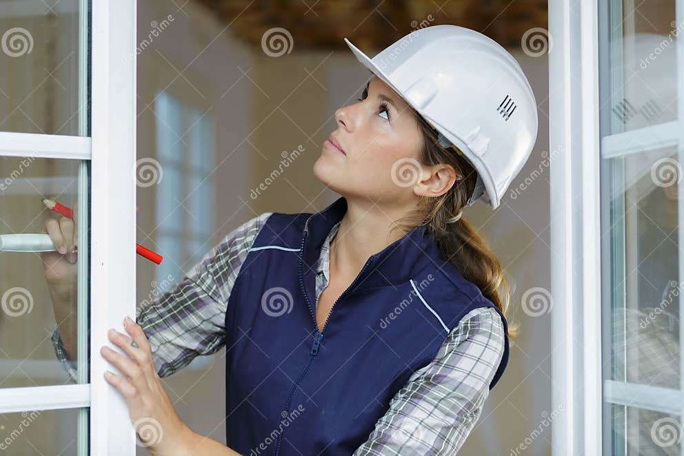 Female Window Fitter at Work Stock Image - Image of lookingup, inspect ...