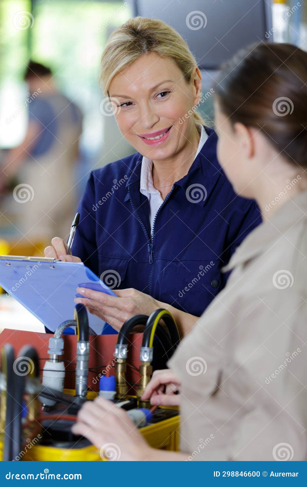 Female Worker and Apprentice Working with Pipes Stock Photo - Image of ...