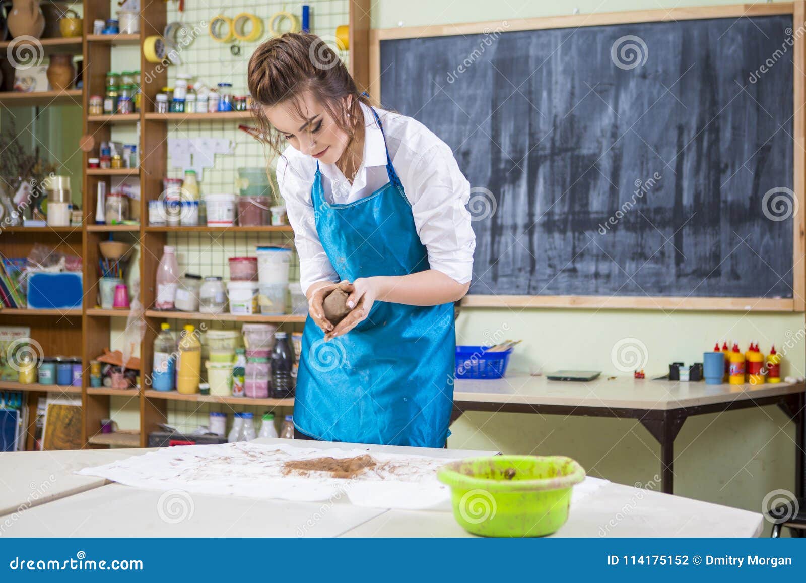 Female Worker in Apron Moulding a Piece of Clay Stock Photo - Image of ...