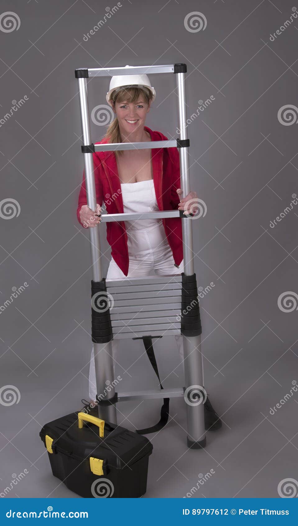 Female Worker Assembles a Telescopic Ladder Stock Photo - Image of ...