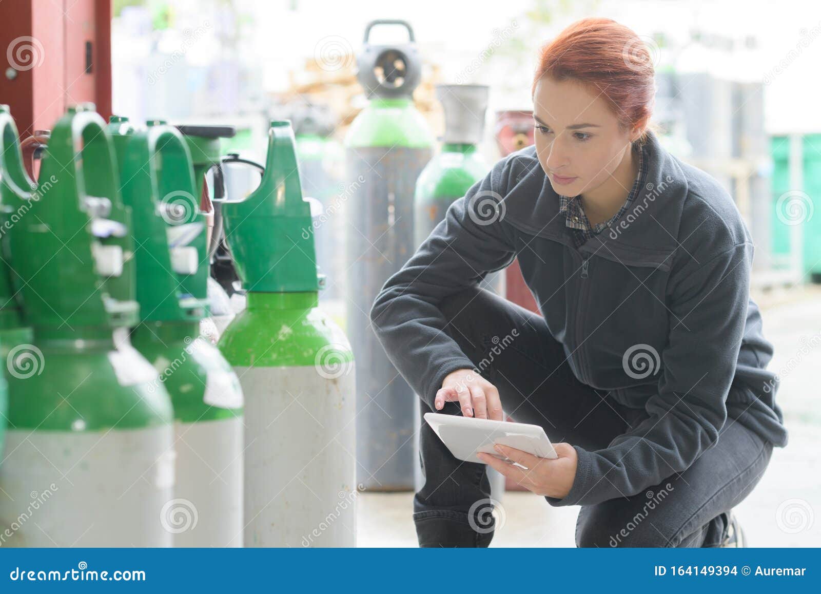 Female Worker Checking Oxygen Bottles Stock Photo - Image of isolated ...