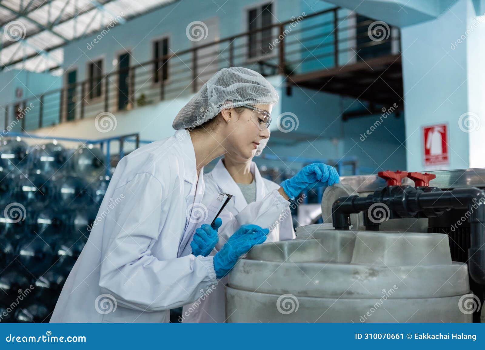 Female Worker Checking Quality Process of Filtering Cleanliness ...