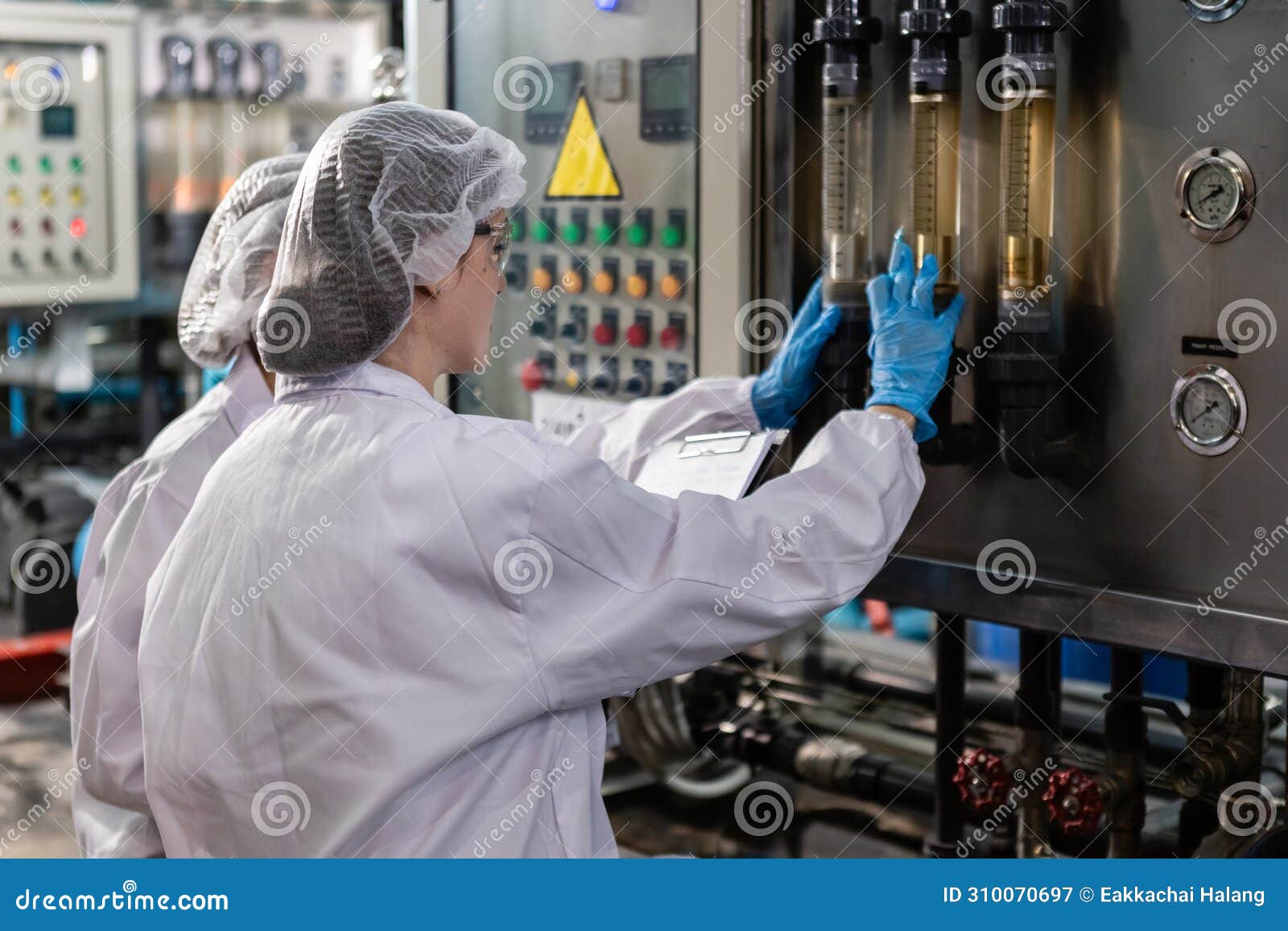 Female Worker Checking Quality Process of Filtering Cleanliness ...