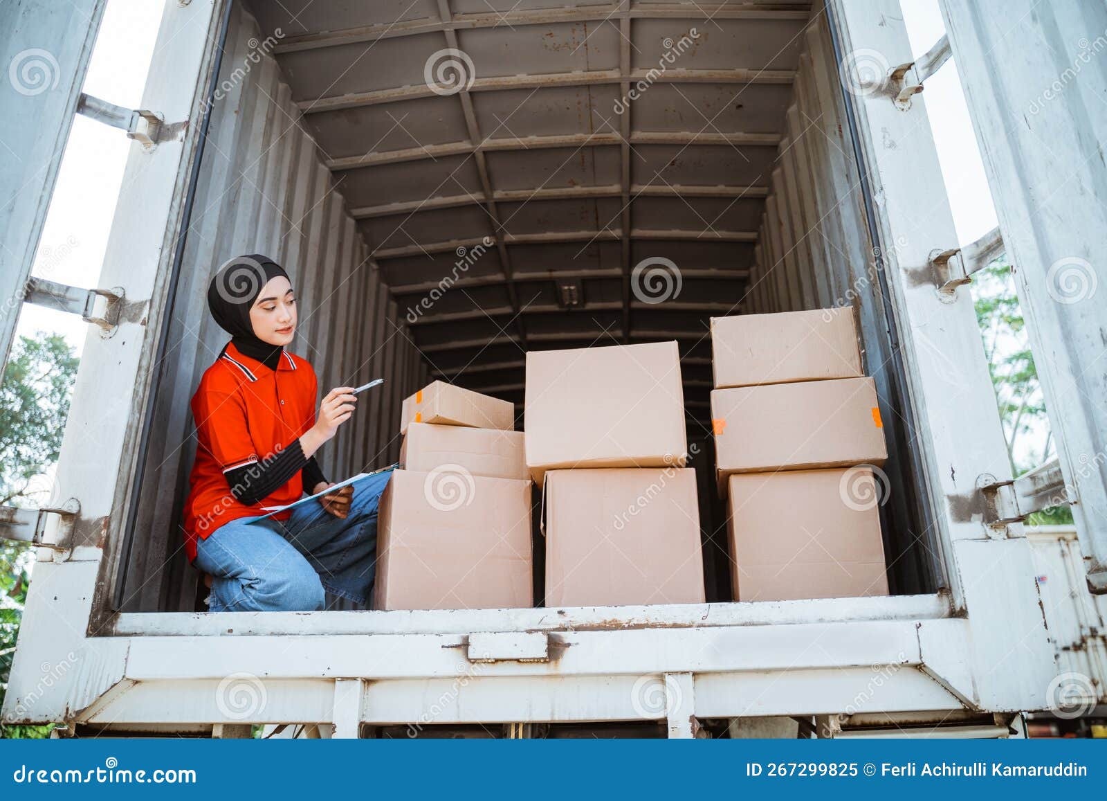 Female Worker Counting Boxes of Packages in a Container Stock Image ...