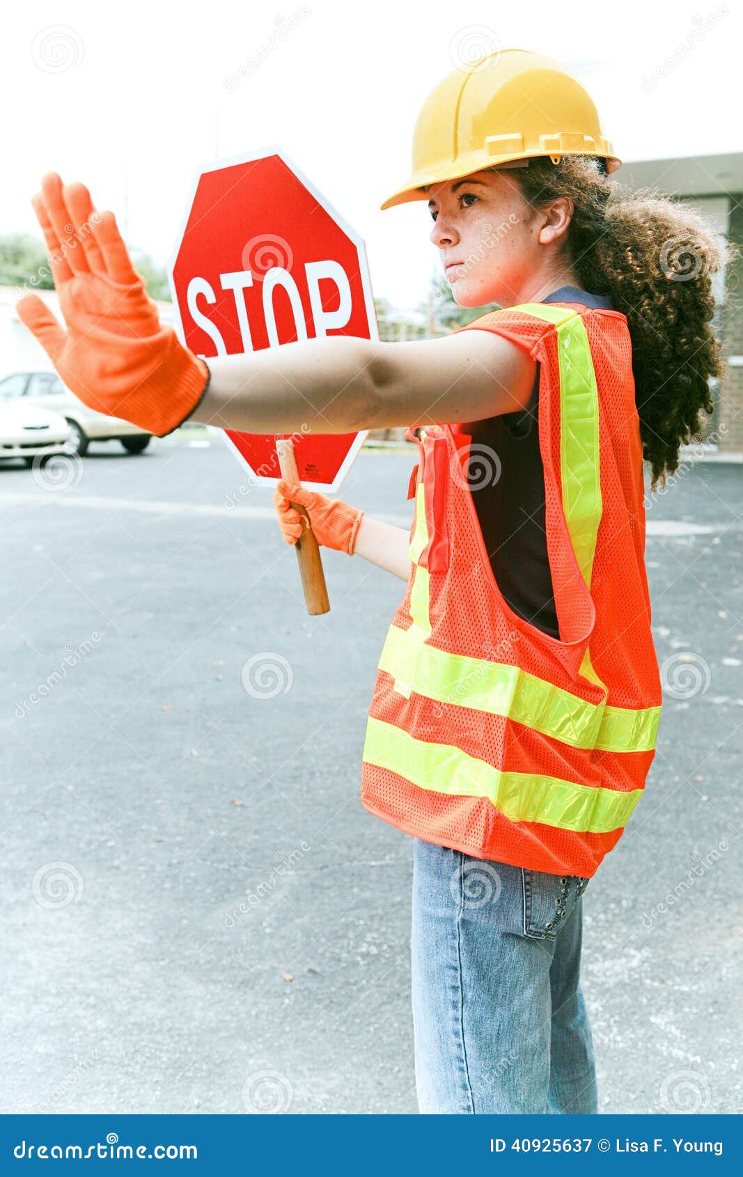 Female Worker Directs Traffic Stock Image - Image of gloves, people ...