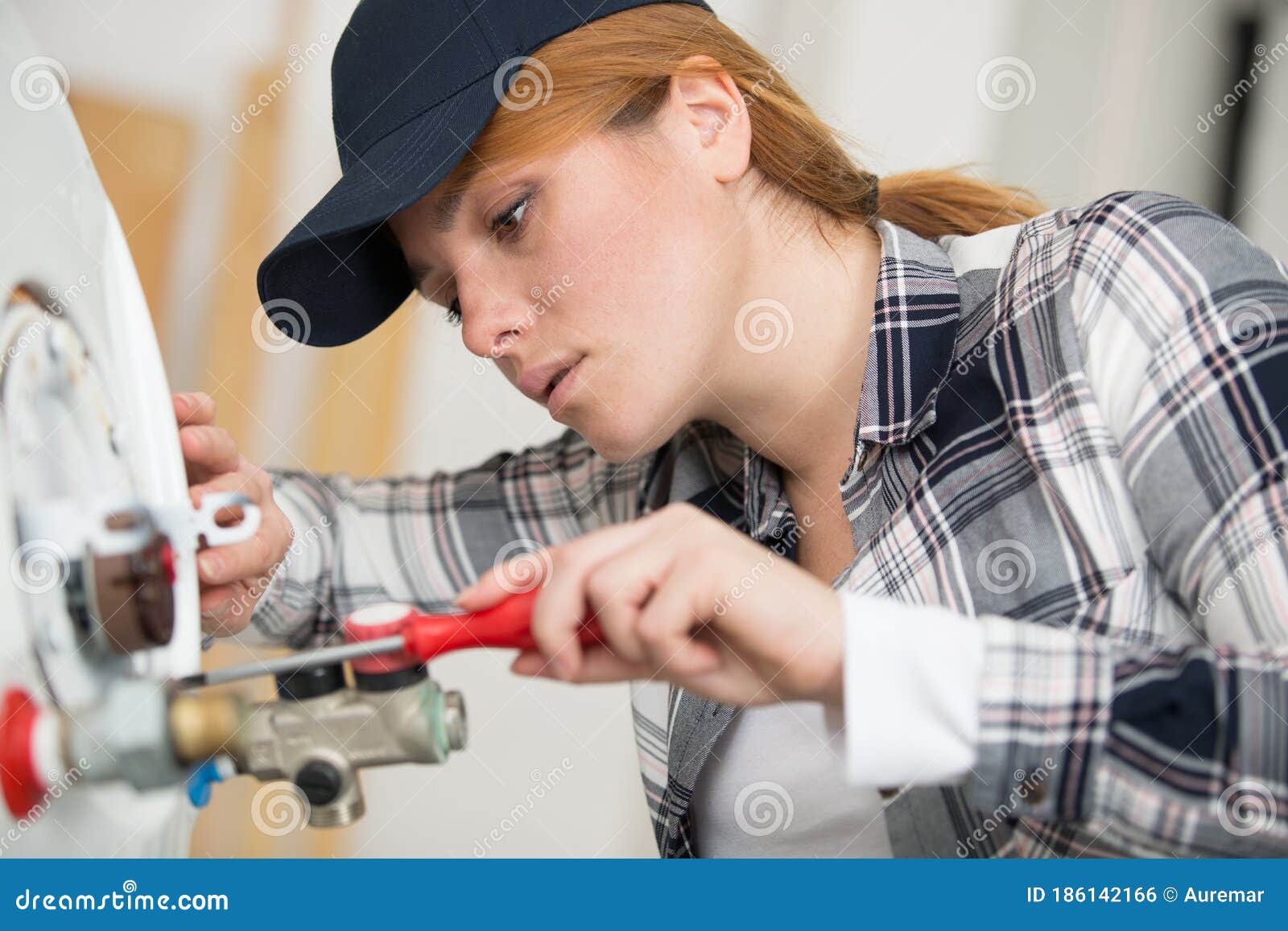 Female Worker Fixing Boiler Stock Photo - Image of female, installing ...
