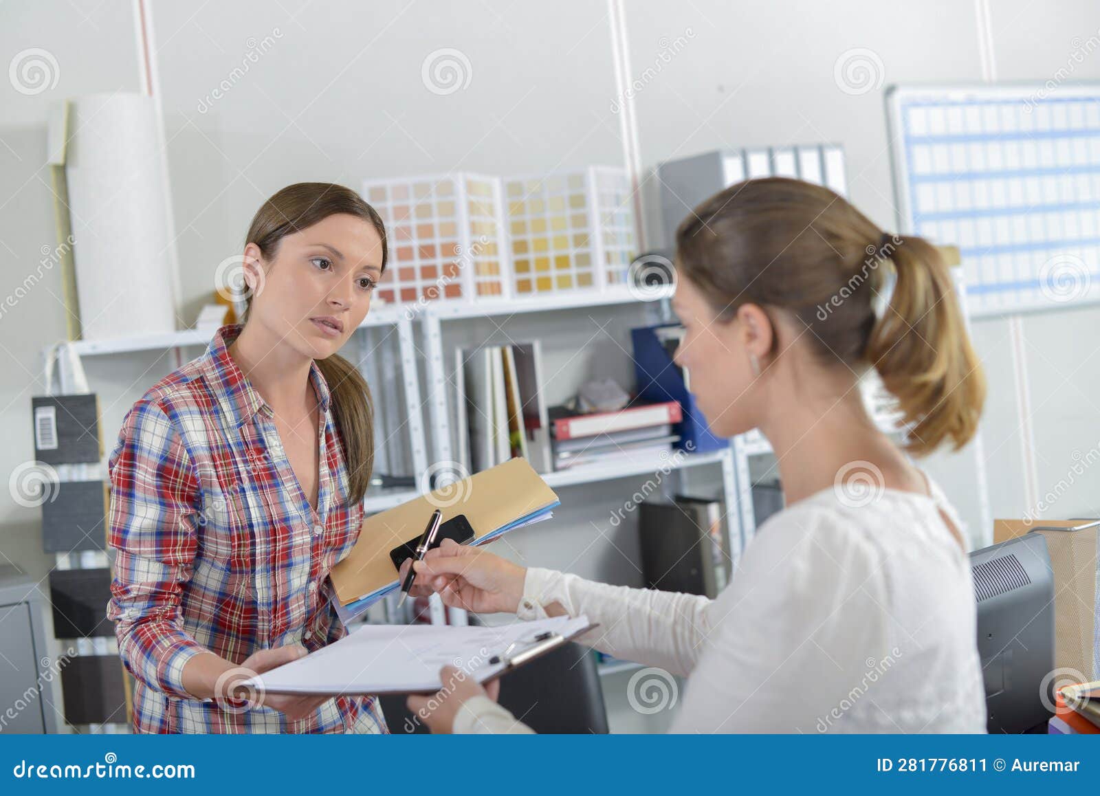 Female Worker Handing Over Document Stock Image - Image of caucasian ...