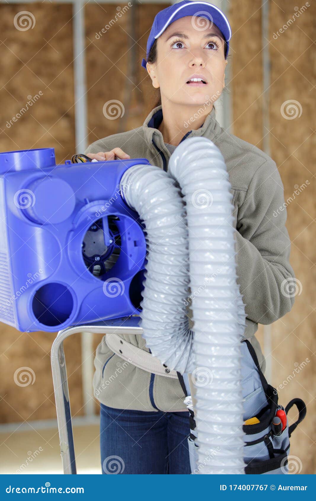 Female Worker Holding New Air Conditioning Unit Stock Image - Image of ...