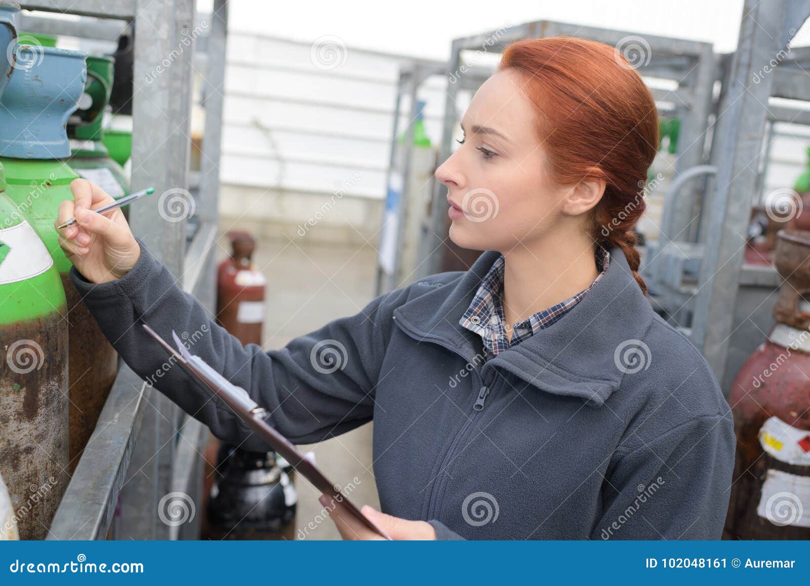 Female Worker Inspecting Gas Tanks Stock Image - Image of danger ...