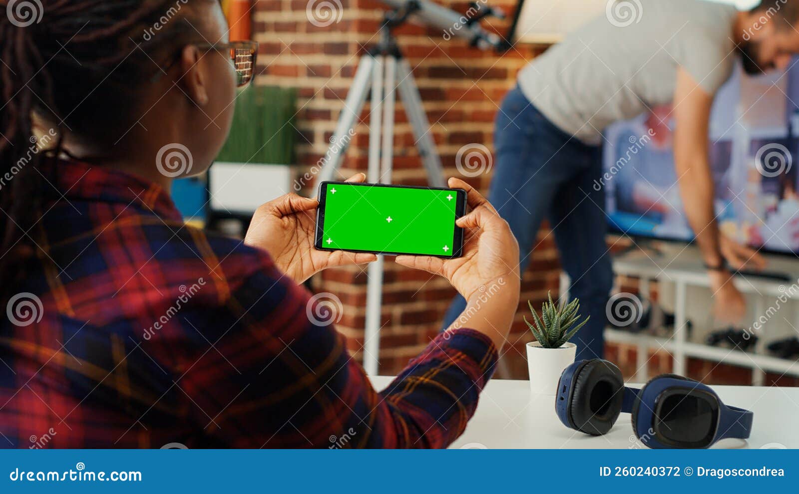 Female Worker Looking at Horizontal Greenscreen on Smartphone Stock ...