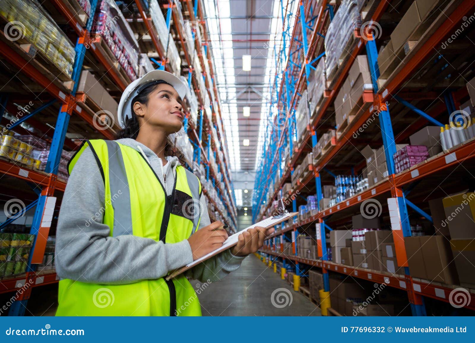 Female worker looking up stock photo. Image of coworkers - 77696332