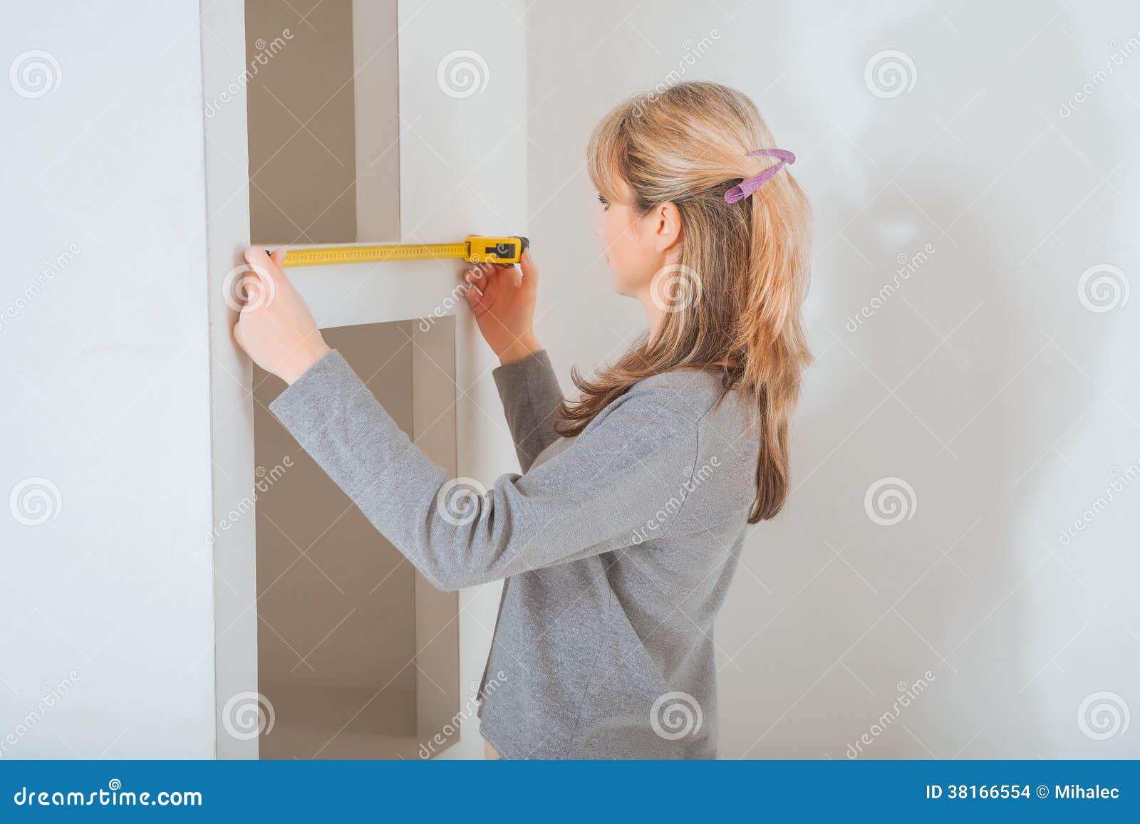 Female Worker Measuring with Tape Measure Stock Photo - Image of ...
