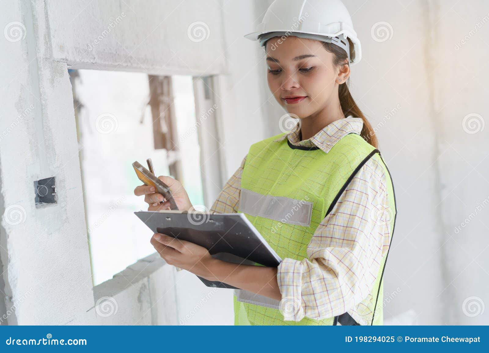 Female Worker Occupation. Woman Inspector / Architect Checking Interior ...