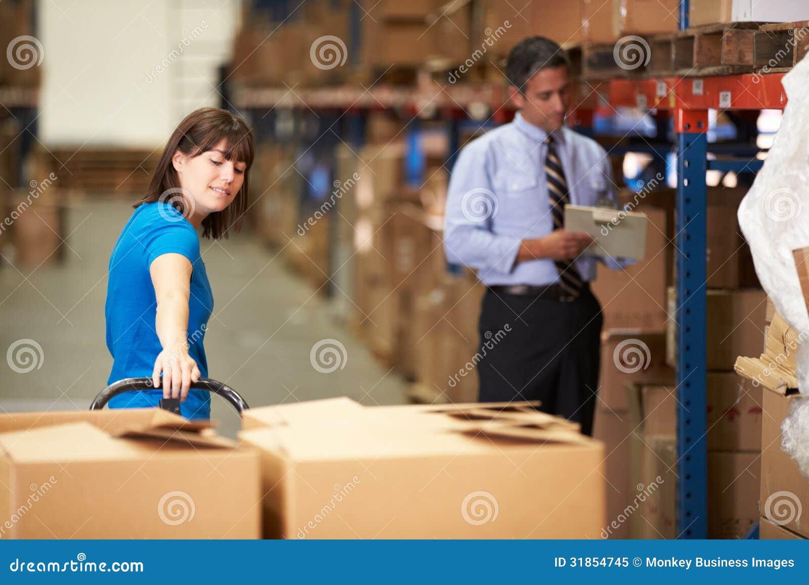 Female Worker Pulling Pallet in Warehouse Stock Image - Image of person ...