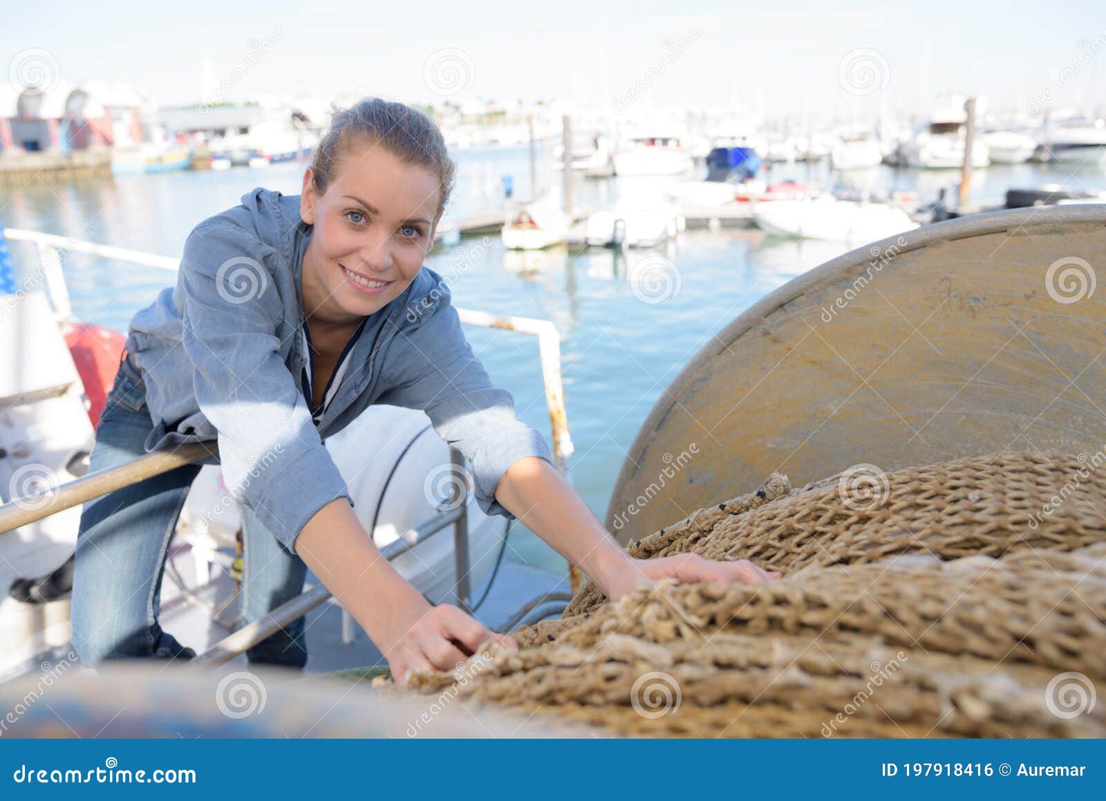 Female Worker Reaching Towards Fishing Nets Stock Photo - Image of ...