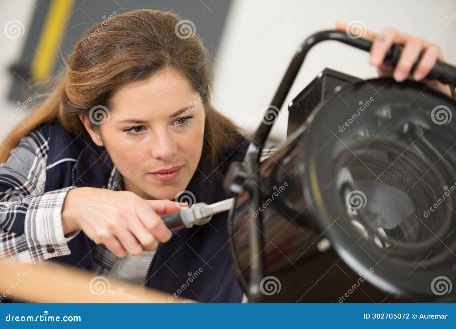 Female Worker Repairing Electrical Appliance Stock Photo - Image of ...
